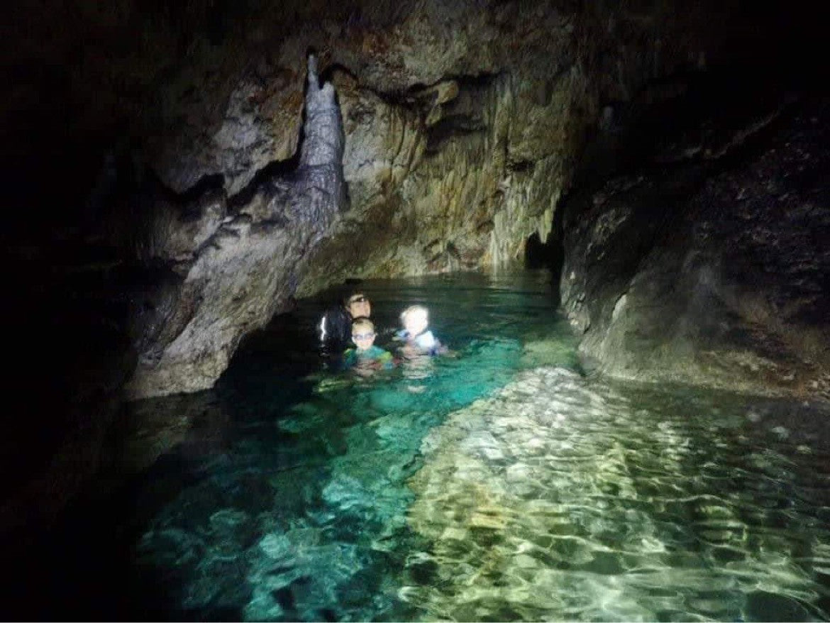 Deep Dive Exploration at Anahulu Cave Pool – Tonga Travel Troupe
